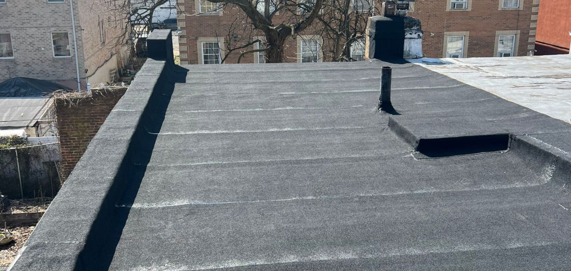 Project: New Flat Roof Installation in the Bronx - American Roofing ...